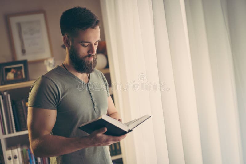 Man reading a book stock image. Image of handsome, pensive - 110283759 Man reading a book stock image. Image of handsome, pensive - 110283759
