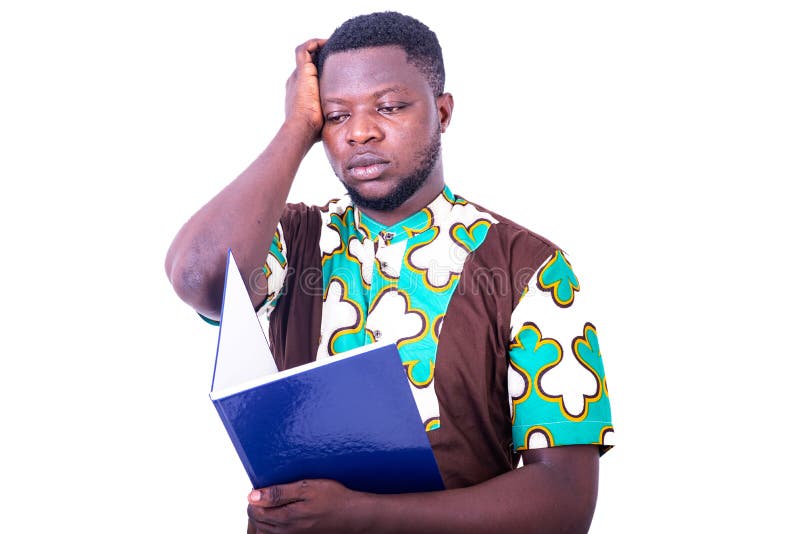 Pensive Young Man Reading a Notebook Stock Photo - Image of expression ...