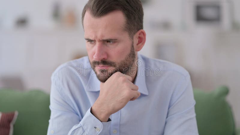 Pensive Young Man Thinking at Home Stock Photo - Image of sofa ...