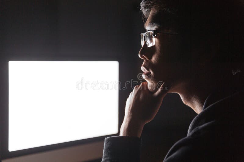 Pensive Young Man Thinking and Using Blank Screen Computer Stock Photo ...
