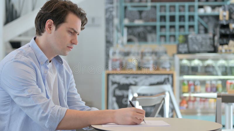 Pensive Creative Man Writing on Paper, Thinking Stock Photo - Image of ...