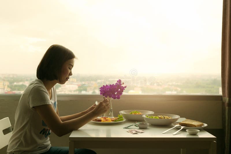 Young Woman Sitting Room Table Eating Dinner Alone Stock Photos - Free ...