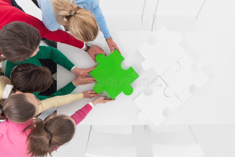 People assembling puzzle stock image. Image of white - 71787969