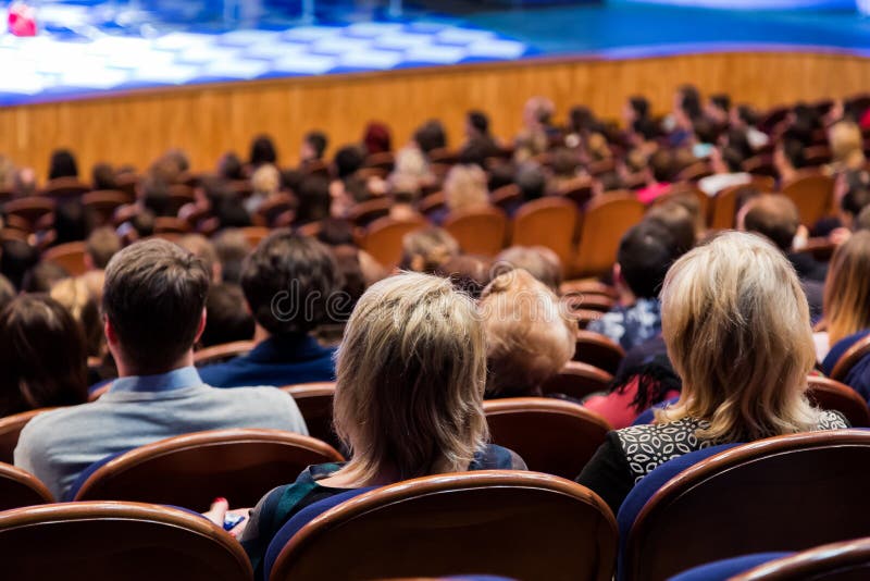 People in the Auditorium Looking at the Stage. Shooting from the Back ...