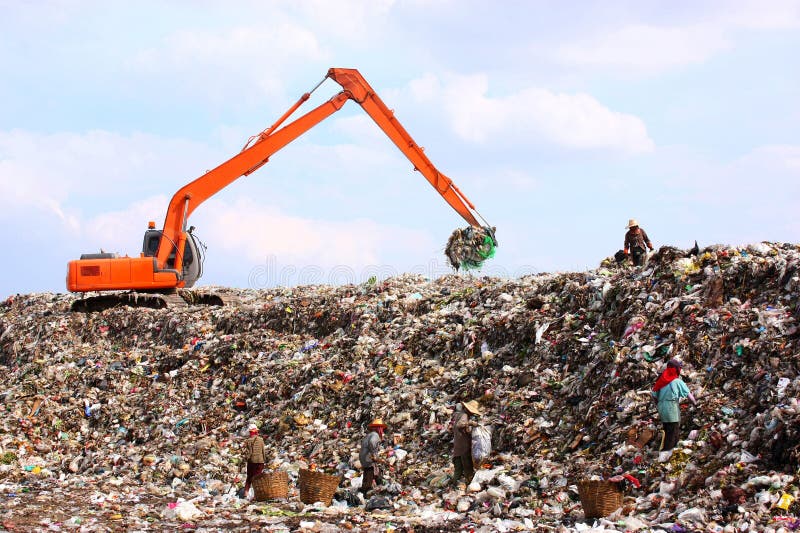 Backhoe Working on Garbage Dump in Landfill. People Working at Landfill ...