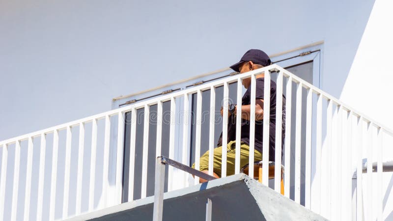 People on the Balcony a with White Building Editorial Stock Image ...