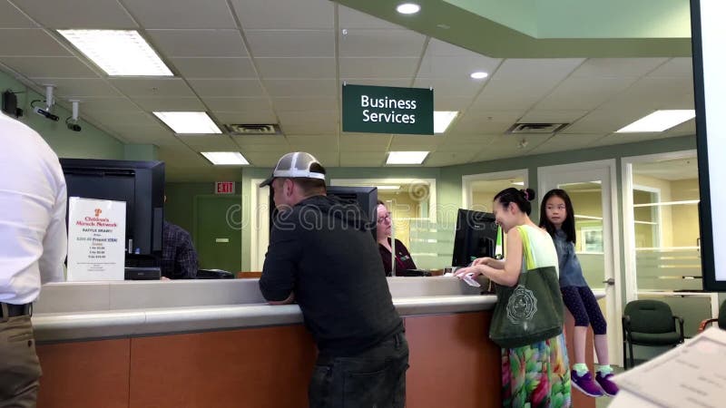People at a Bank Counter Talking To the Teller Stock Footage - Video of ...