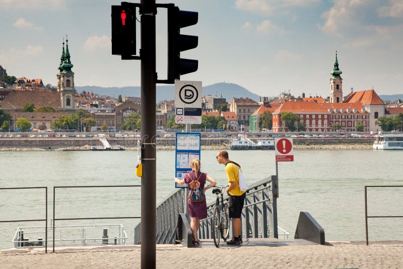 People on the Banks of the River Danube. Tourists Look at the ...