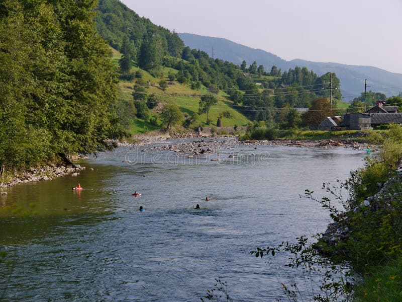 People Bathing in the River on the Background of Mountains Stock Image ...