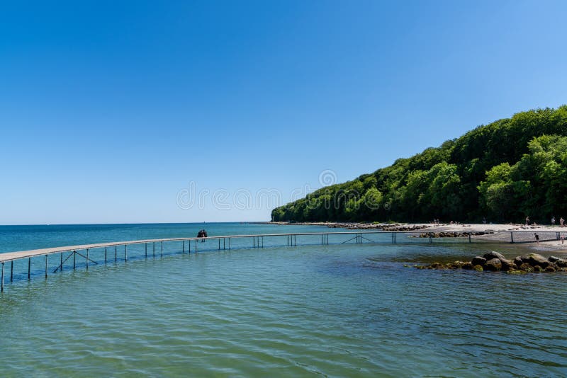 People at the Bay of Aarhus with the Infinite Bridge in the Foreground ...