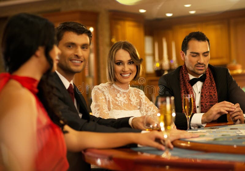 People Behind Gambling Table Stock Image - Image of friend, friendship ...