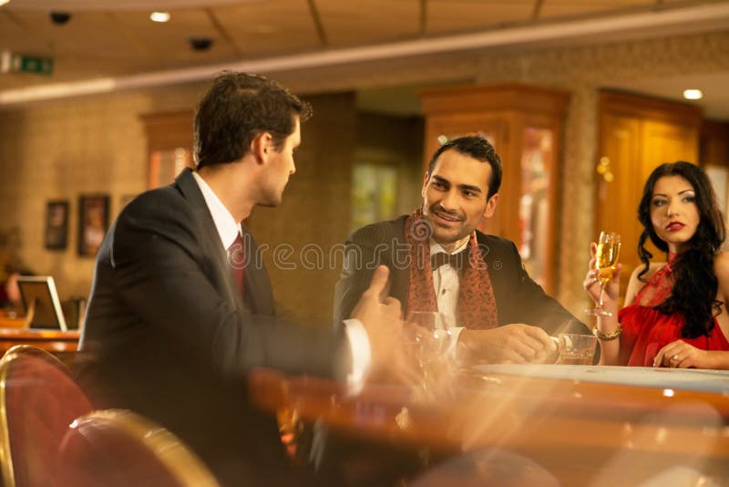 People Behind Gambling Table Stock Image - Image of celebrating, club ...