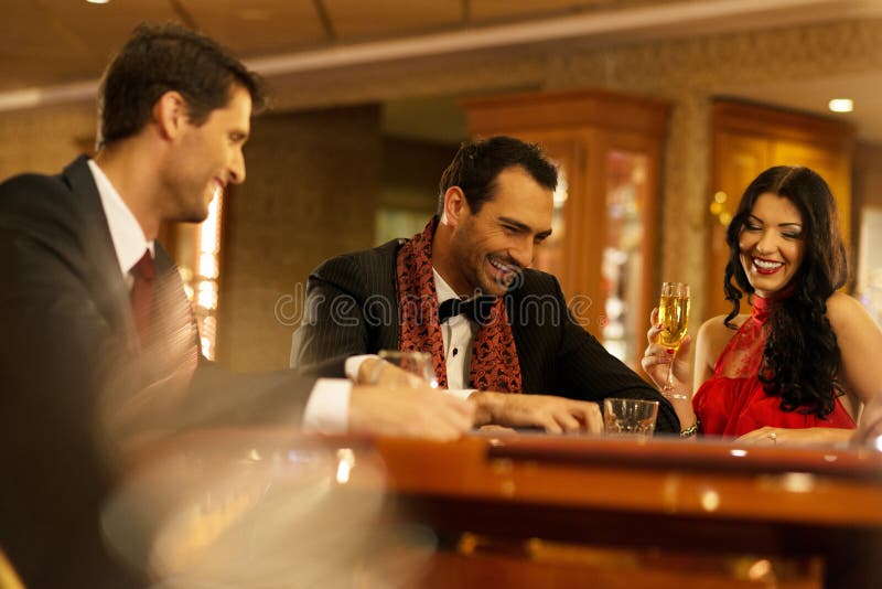 People Behind Gambling Table Stock Photo - Image of fashion, girl: 39158800