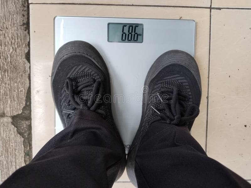 People are Being Weighed at Sixty-eight Kilos Stock Photo - Image of ...