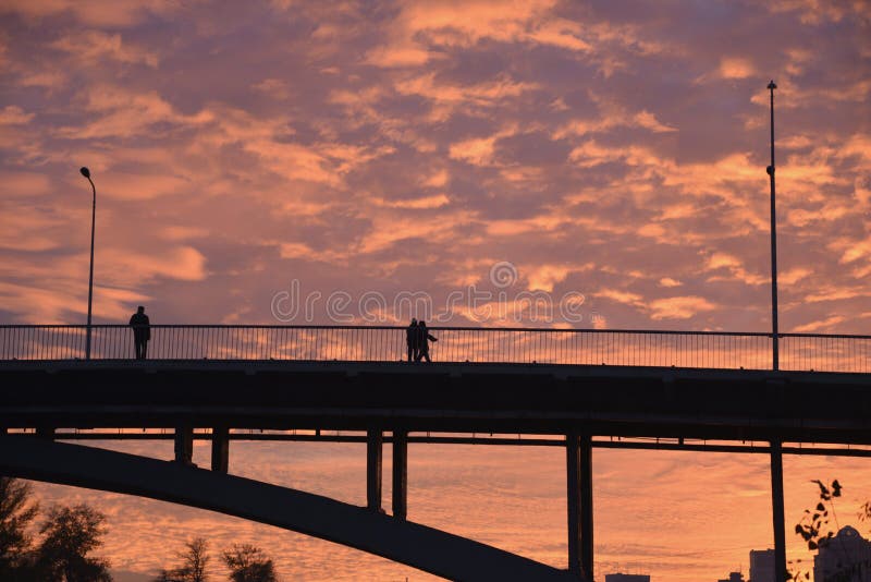 People on the Bridge in Sunset Time Stock Image - Image of overcast ...