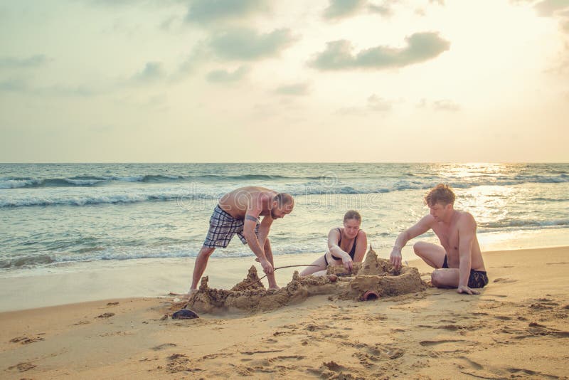 People Build a Castle of Sand on the Ocean. Stock Image - Image of ...