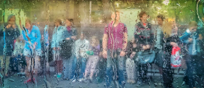 People at the Bus Stop during the Rain Stock Photo - Image of colorful ...