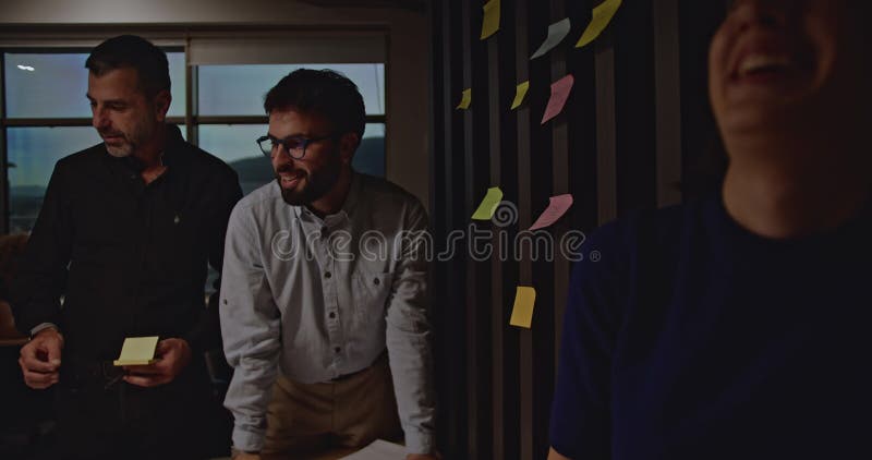 People Collaborating in a Business Meeting Using Sticky Notes To Share ...