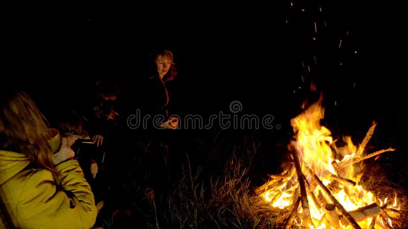 People in the Camp are Warming by the Fire. Stock Video - Video of ...