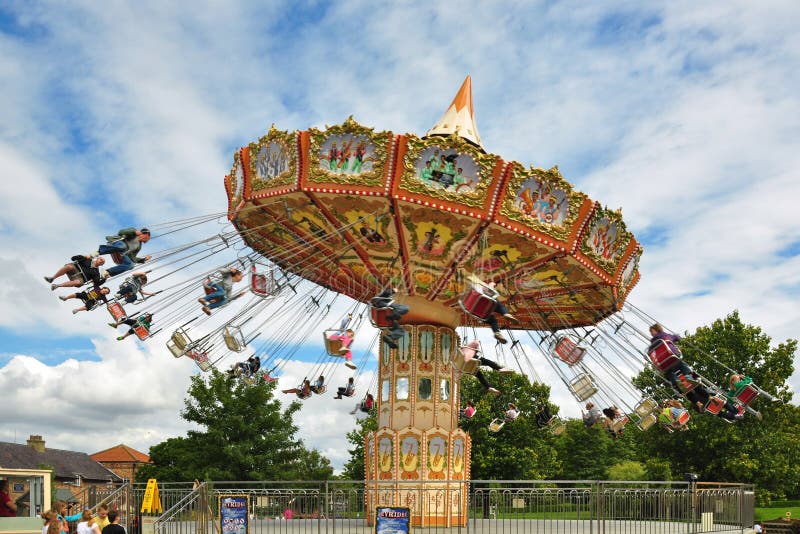 People on Carousel Under Blue Sky with Clouds Editorial Image - Image ...