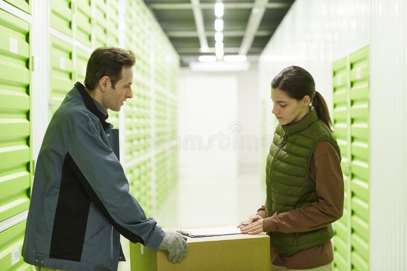 People shipping parcels stock photo. Image of warehouse - 218921560