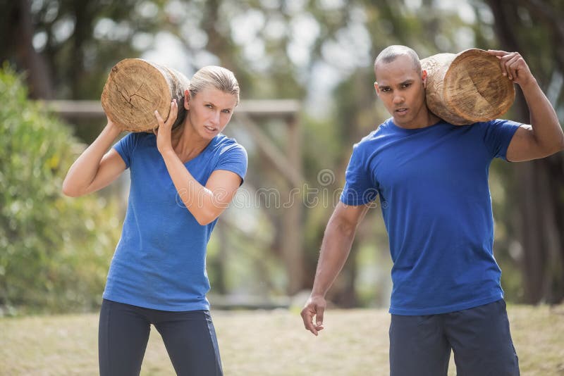 People Carrying Heavy Wooden Logs during Obstacle Course Stock Image ...
