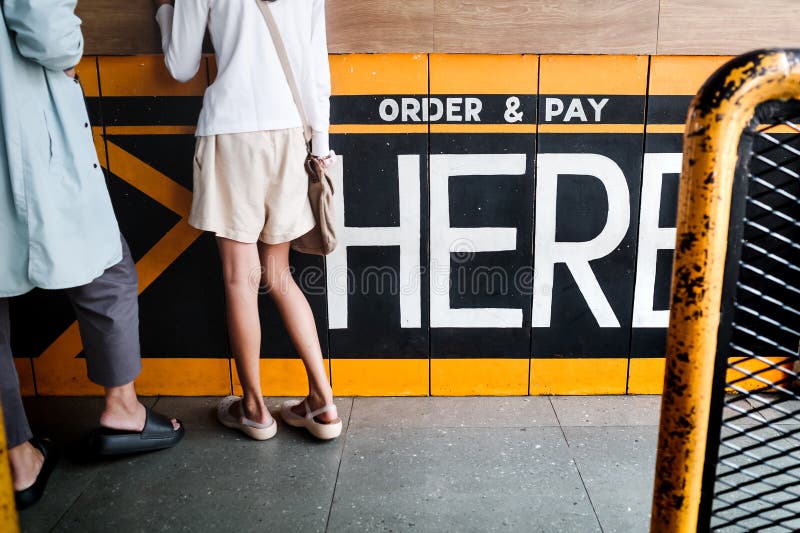 Mother and Daughter Making Order and Payment at the Cashier Counter of ...