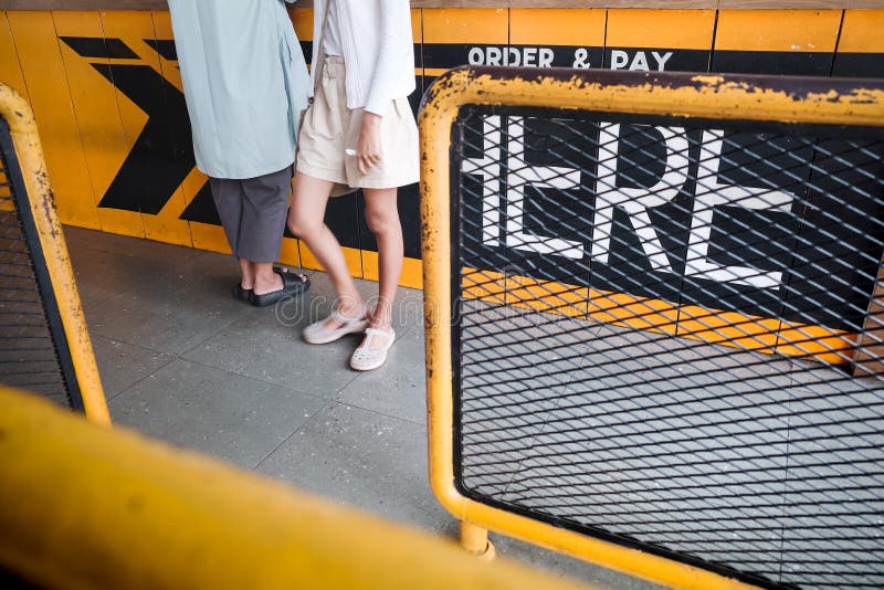 Mother and Daughter Making Order and Payment at the Cashier Counter of ...