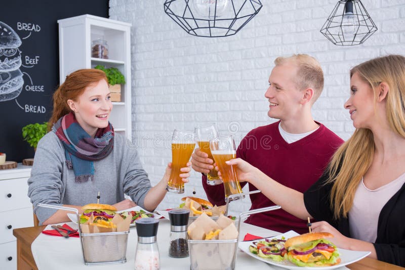 People cheering with beer stock image. Image of fast - 82531653