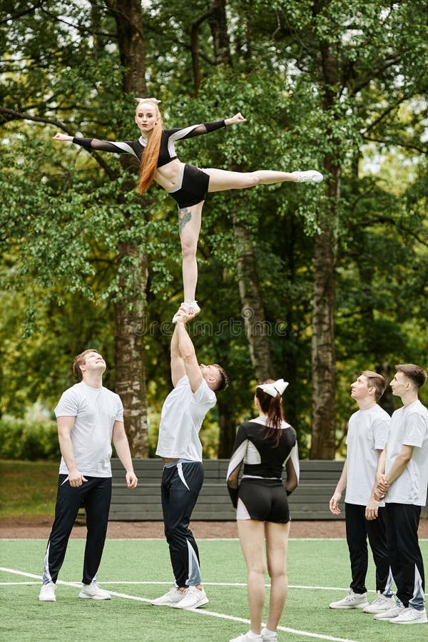 People from Cheerleading Team Practicing Outdoors Stock Image - Image ...