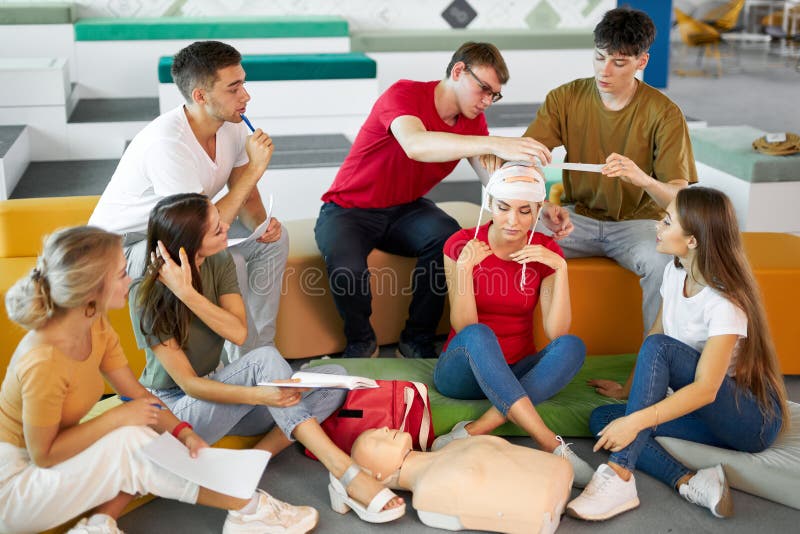People at Class of Giving First Aid, Learn Bandaging the Head Stock ...