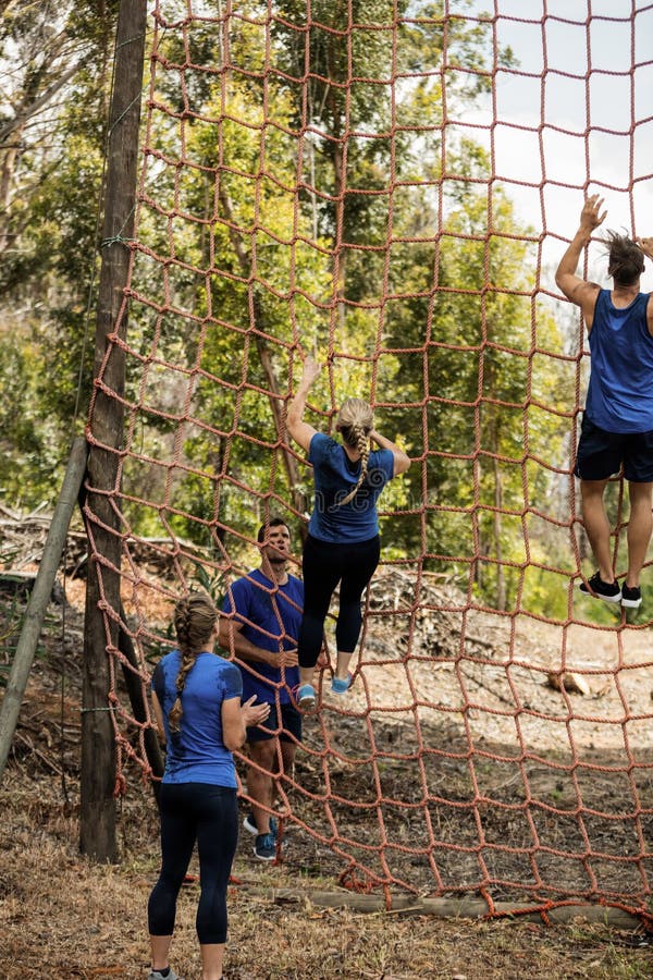 People Climbing a Net during Obstacle Course Stock Image - Image of ...