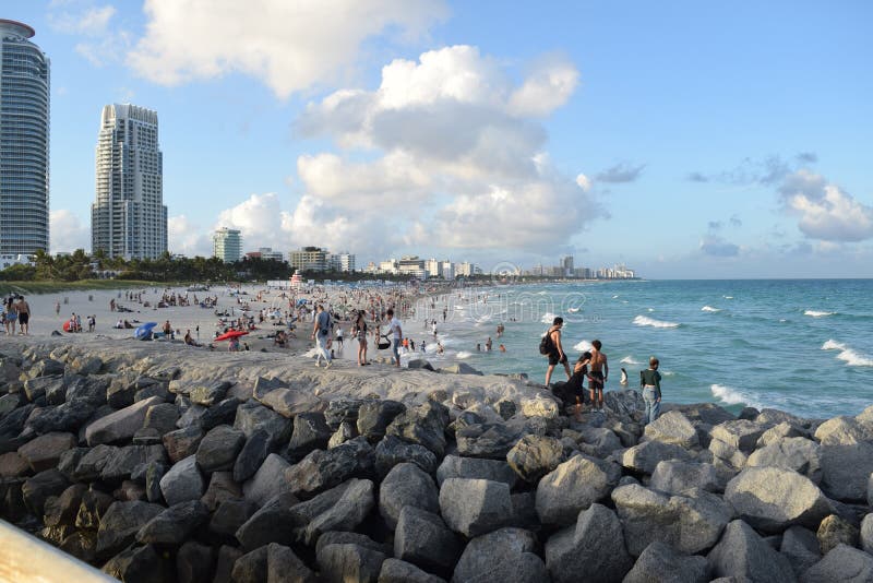 People Climbing on the Rocks at South Beach Miami Editorial Photo ...