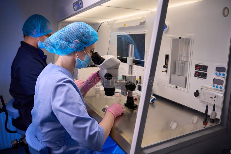 People Collaborating on Lab Work Using Advanced Equipment Stock Image ...
