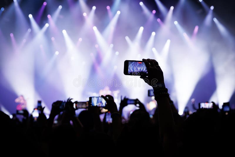 People at Concert Shooting Video or Photo Using Mobile Phones. Stock ...