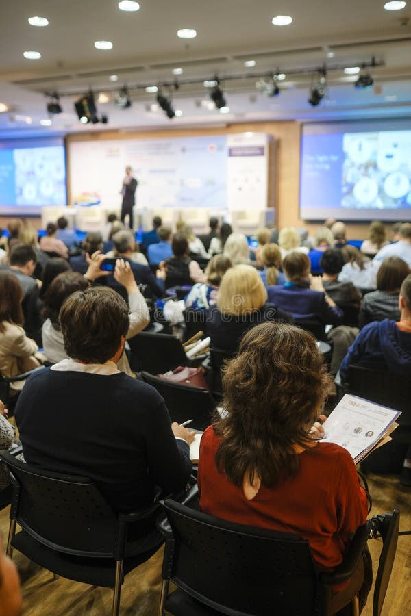 People on a conference editorial stock image. Image of back - 126458949