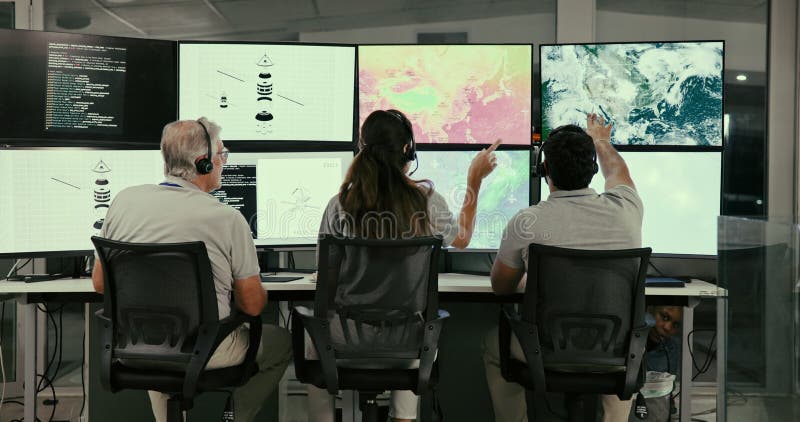 People, Control Room and Group Monitor Weather Pattern on Satellite ... People, Control Room and Group Monitor Weather Pattern on Satellite ...