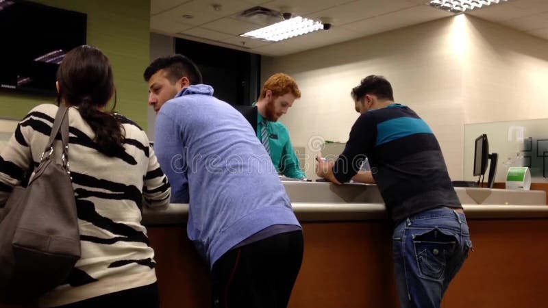 People at Counter Talking To the Teller Stock Video - Video of public ...