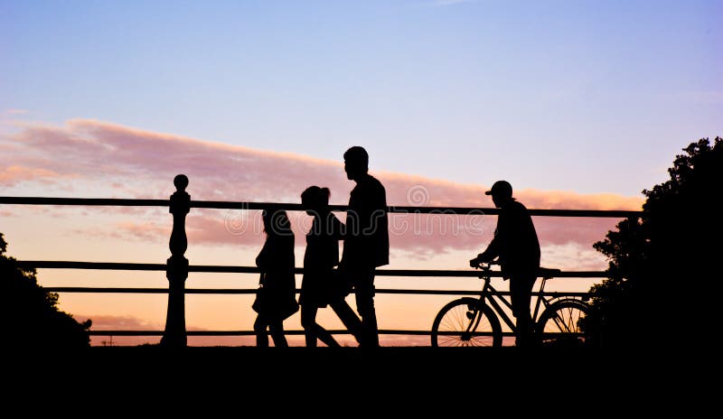 People Crossing Bridge in Sunset Stock Image - Image of sunset, group ...