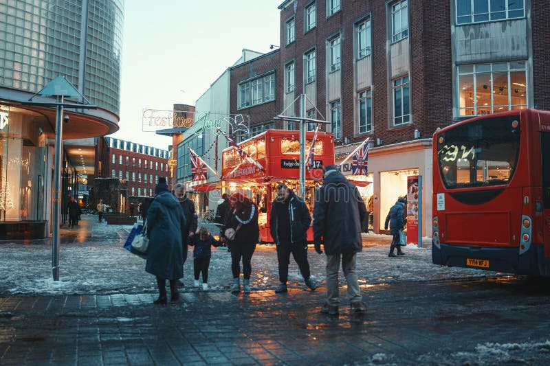 People Crossing Road in Front of Christmas Decorations in Exeter ...