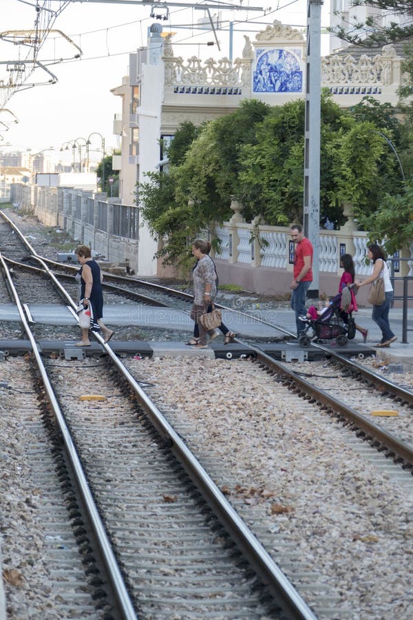 People Crossing a Subway Level Crossing Editorial Stock Photo - Image ...