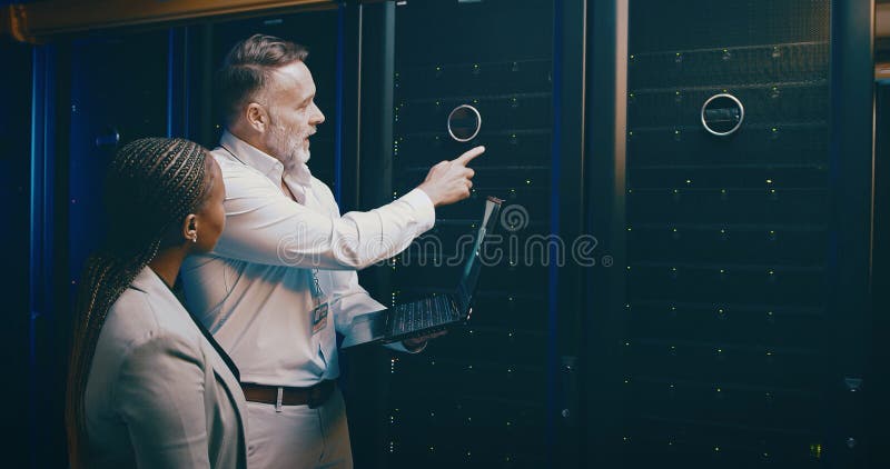 People, Cyber Security and Laptop in Server Room, Pointing and ...