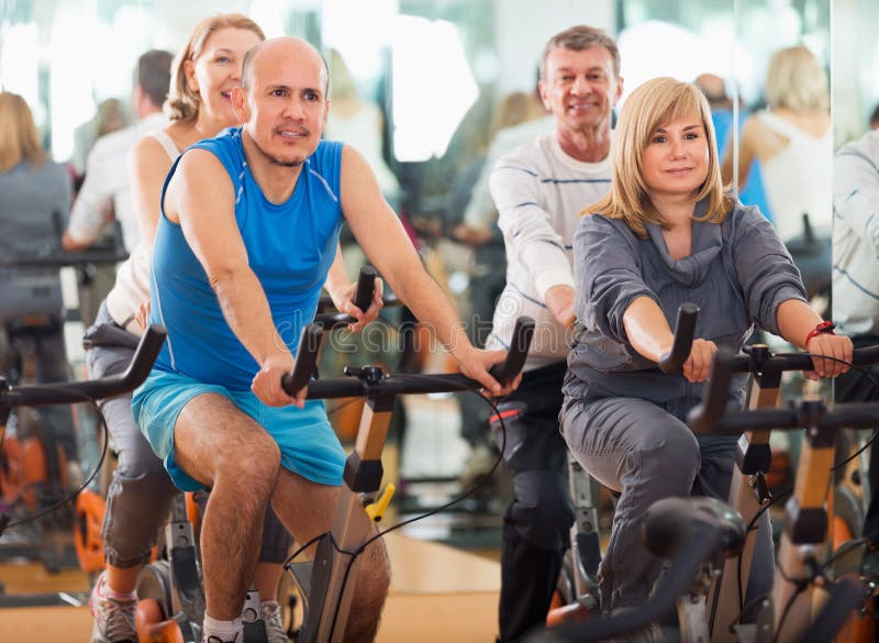 People cycling in a gym stock photo. Image of european - 78699970