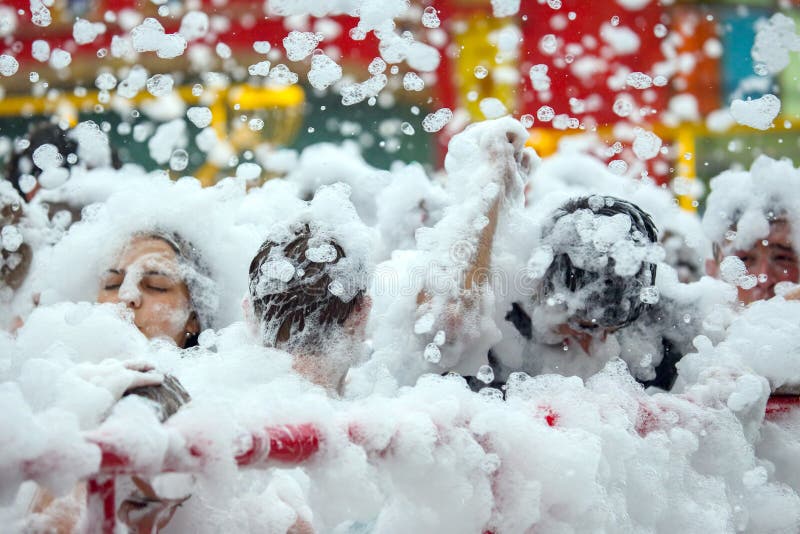 Foam Party. White Airy Foam on the Dance Floor, Many Ladies Dancing ...