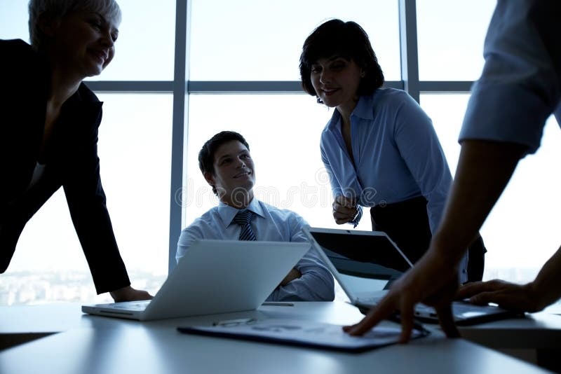 People in dark room stock photo. Image of office, papers - 77337954