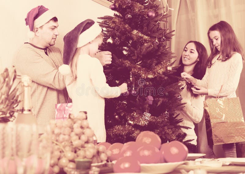 People Decorating Christmas Tree Stock Image - Image of december ...