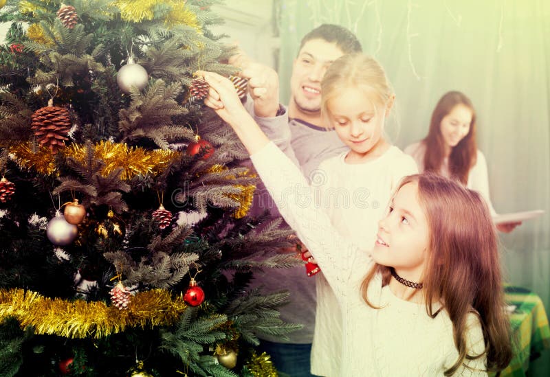 People Decorating Christmas Tree Stock Photo - Image of family, girls ...
