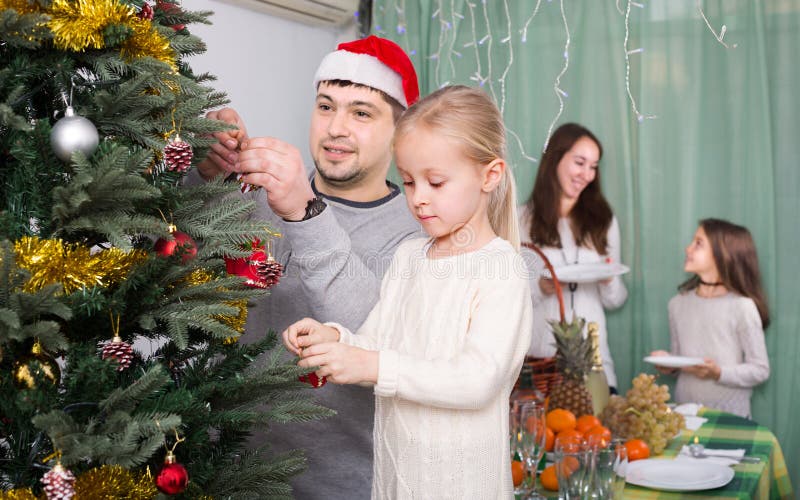 People Decorating Christmas Tree Stock Image - Image of people ...