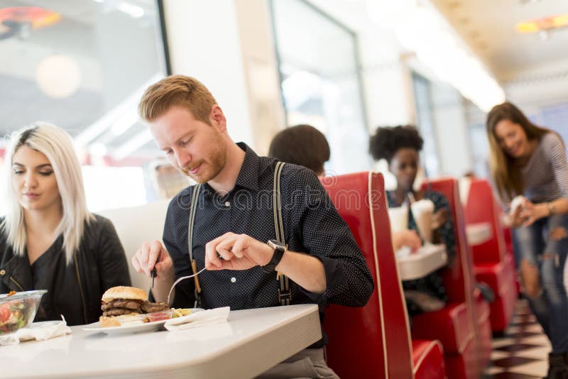 People in diner stock image. Image of gourmet, cheeseburger - 78271759