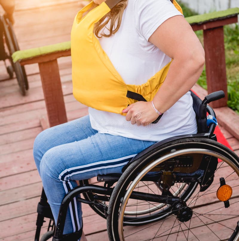 People with Disabilities in Life Vests on the Pier. Stock Image - Image ...